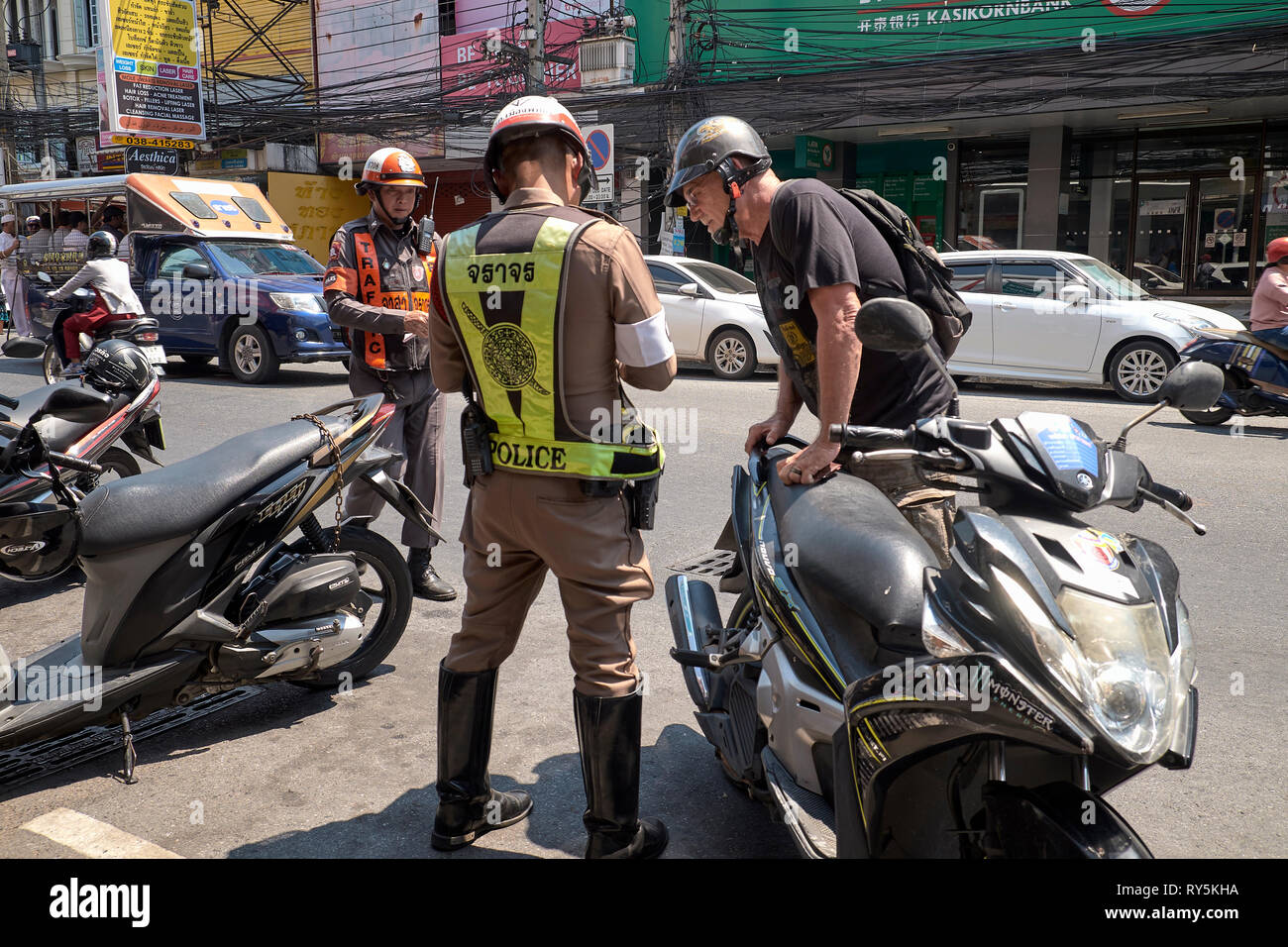 Thailand traffic police. Motorcyclist receiving ticket from Thailand ...
