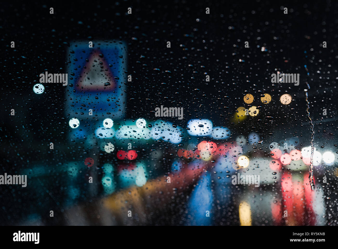 Real life rain drop effects on heavy traffic with traffic sign from car ...