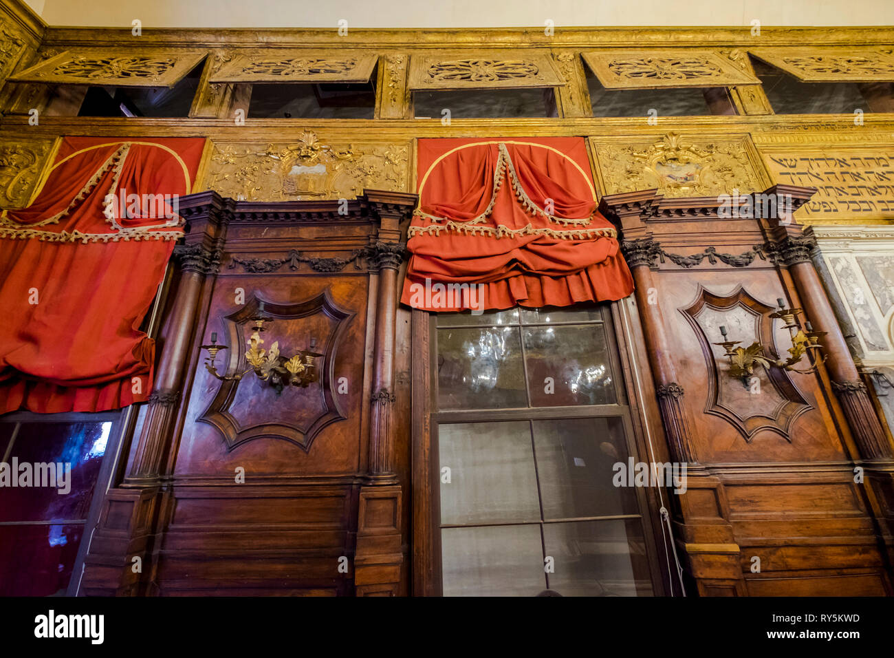 Looking up at the women's gallery behind gold shutters at the Jewish ...