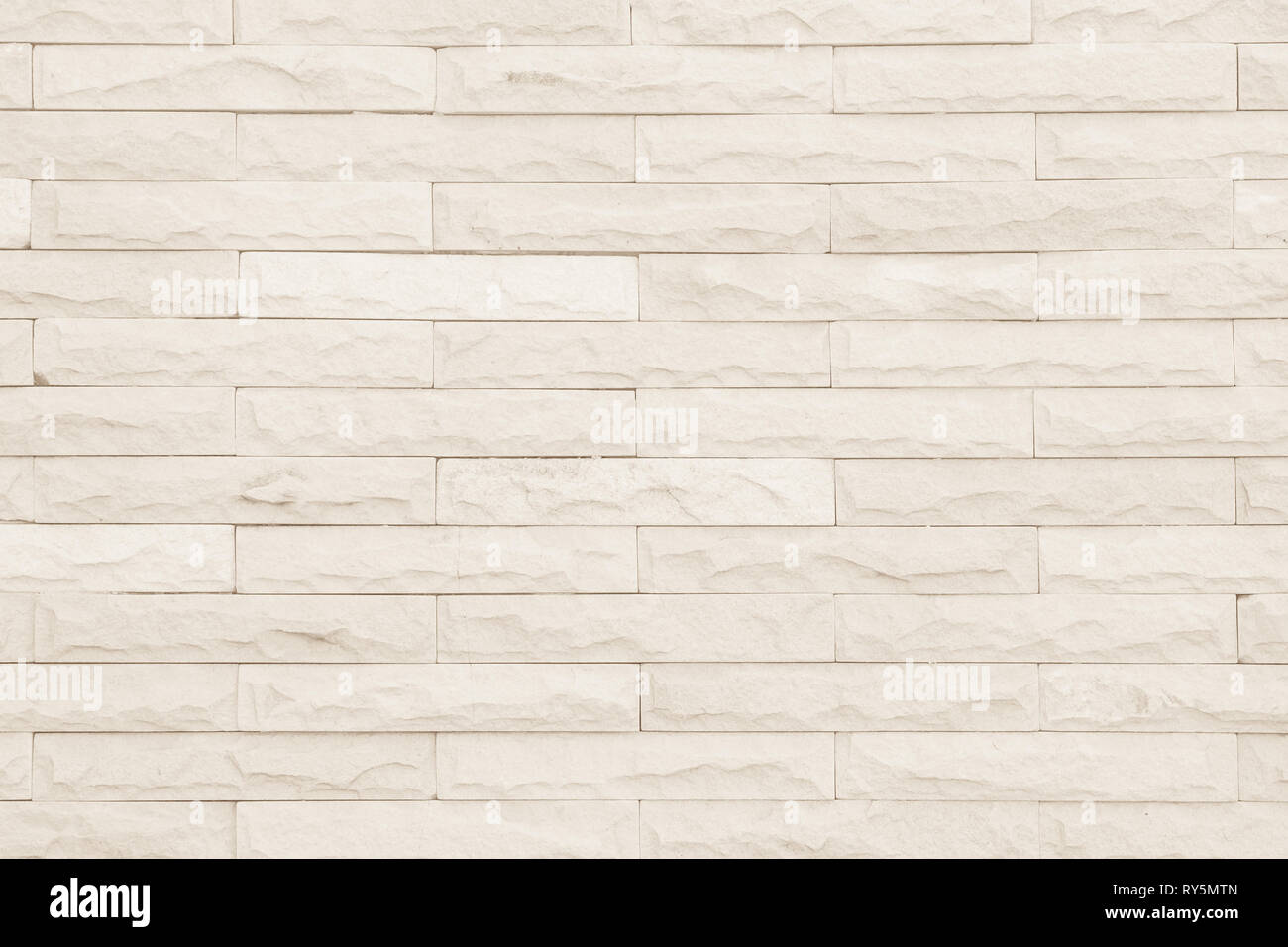 Cream and white brick wall texture background. Brickwork or stonework ...