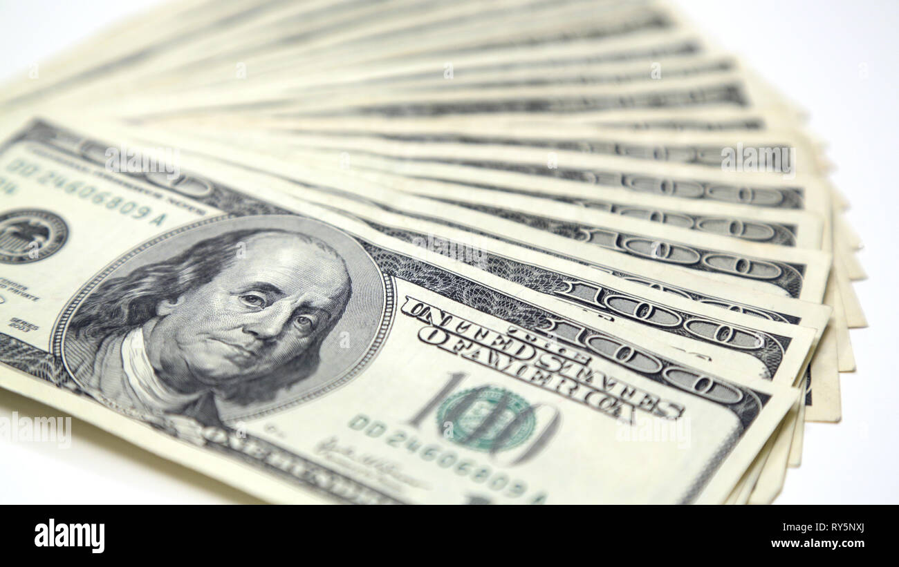 Many 100 Dollar Bills Fanned on White Background Stock Photo - Alamy