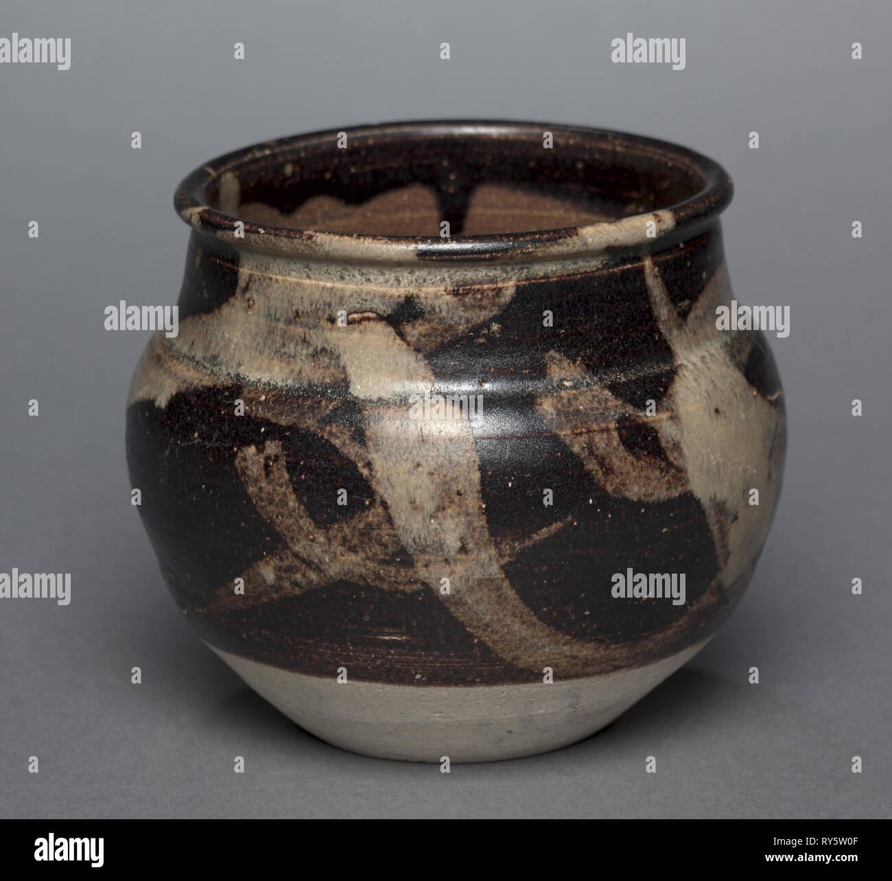Glazed stoneware with resist and slip painted decoration hi-res stock ...