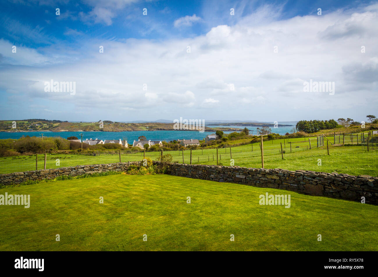 green fields in Schull Village, West Cork Stock Photo - Alamy