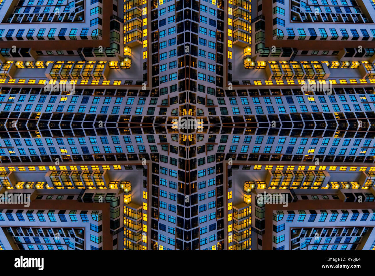 Symmetry view of illuminated modern building Stock Photo - Alamy