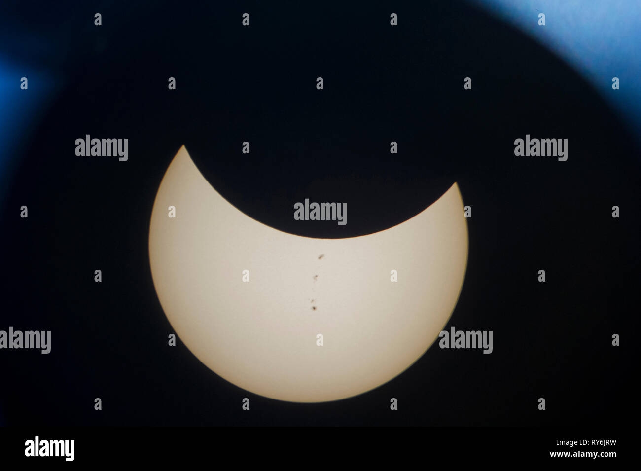 Crescent moon seen through astronomy telescope at night Stock Photo - Alamy