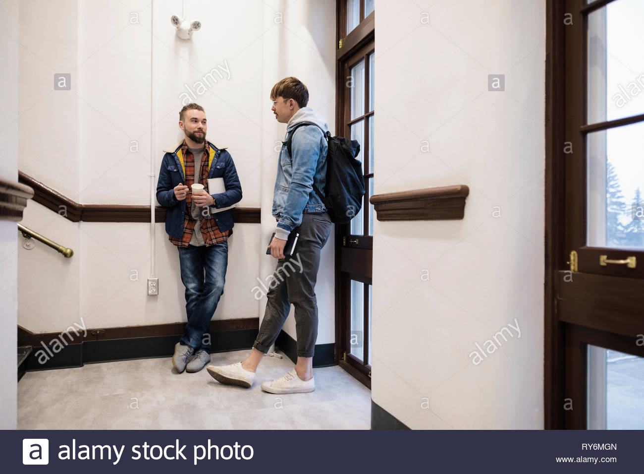 Two students talking men hi-res stock photography and images - Alamy