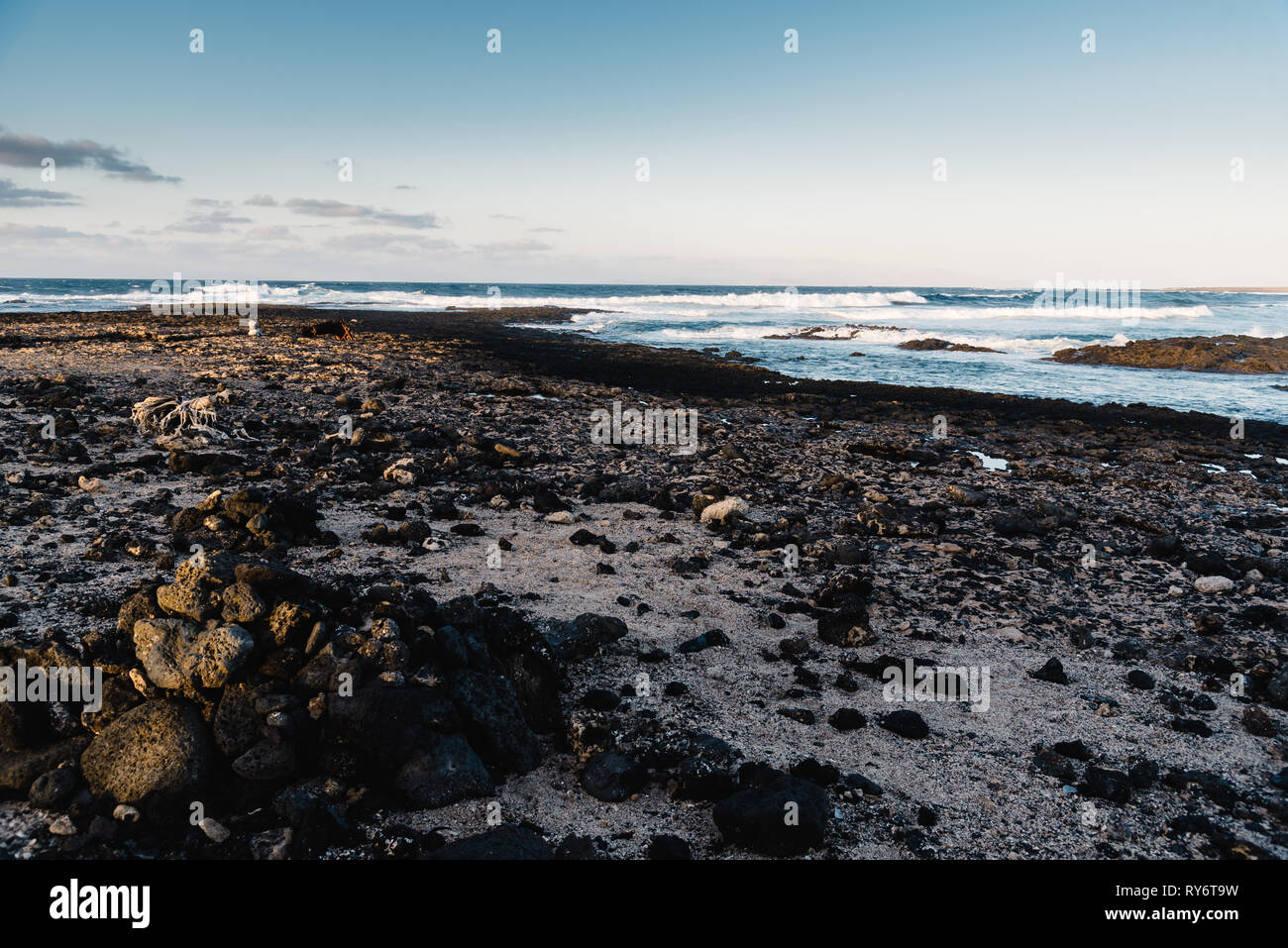 Scenic view of rocky beach at sunset, Cotillo, Fuerteventura, Canary ...