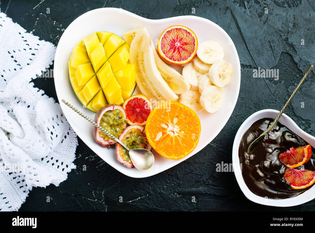 Healthy and fresh fruits on a plate Stock Photo - Alamy