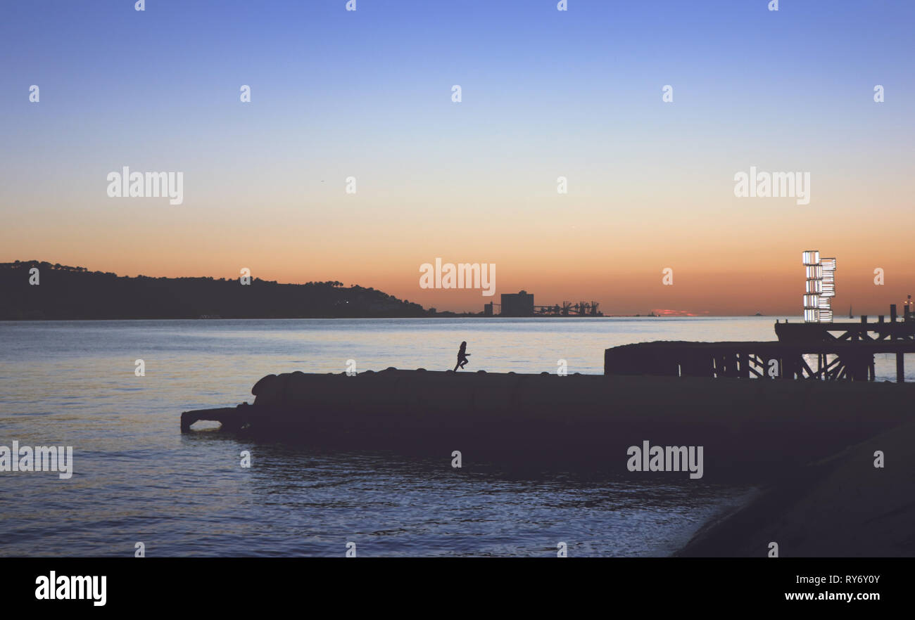 Young man standing jetty hi-res stock photography and images - Alamy