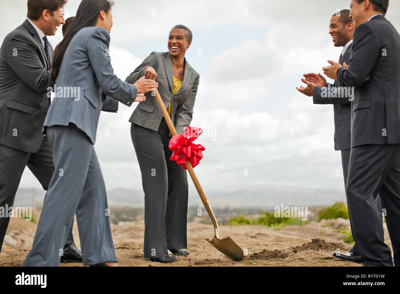 Group of business colleagues breaking ground on a project Stock Photo ...