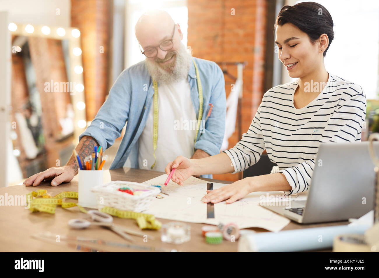 Working in studio tailoring hi-res stock photography and images - Alamy