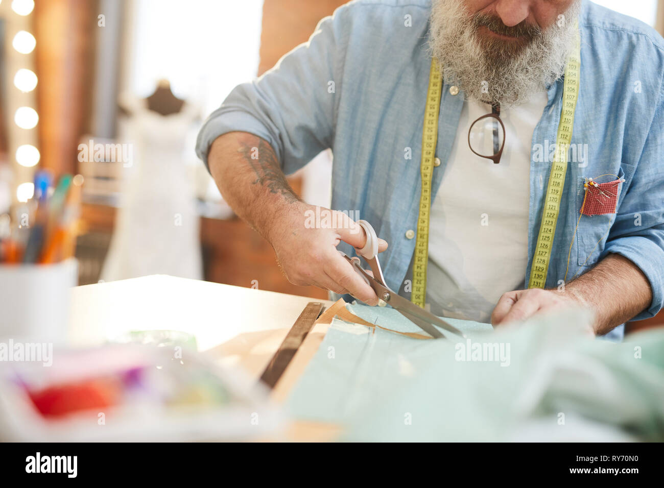 Senior tailor making pattern hi-res stock photography and images - Alamy