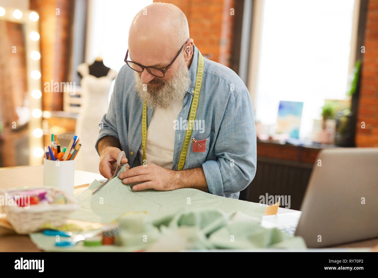 Working in studio of tailoring Stock Photo - Alamy