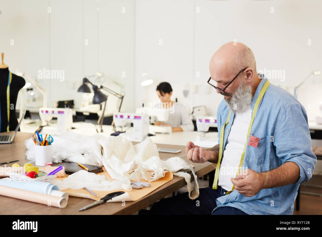 Studio tailoring table hi-res stock photography and images - Alamy