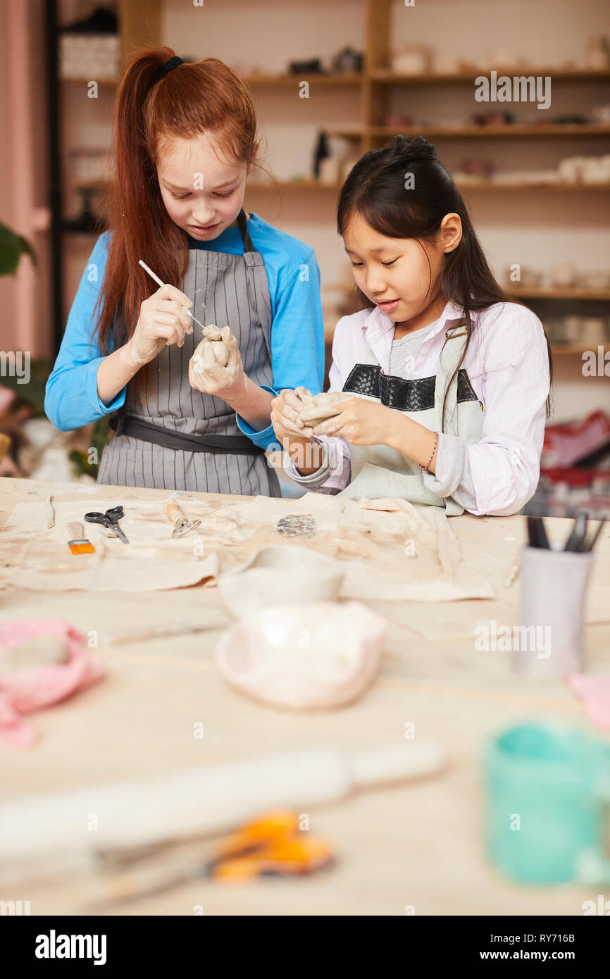 Two Girls in Pottery Workshop Stock Photo - Alamy