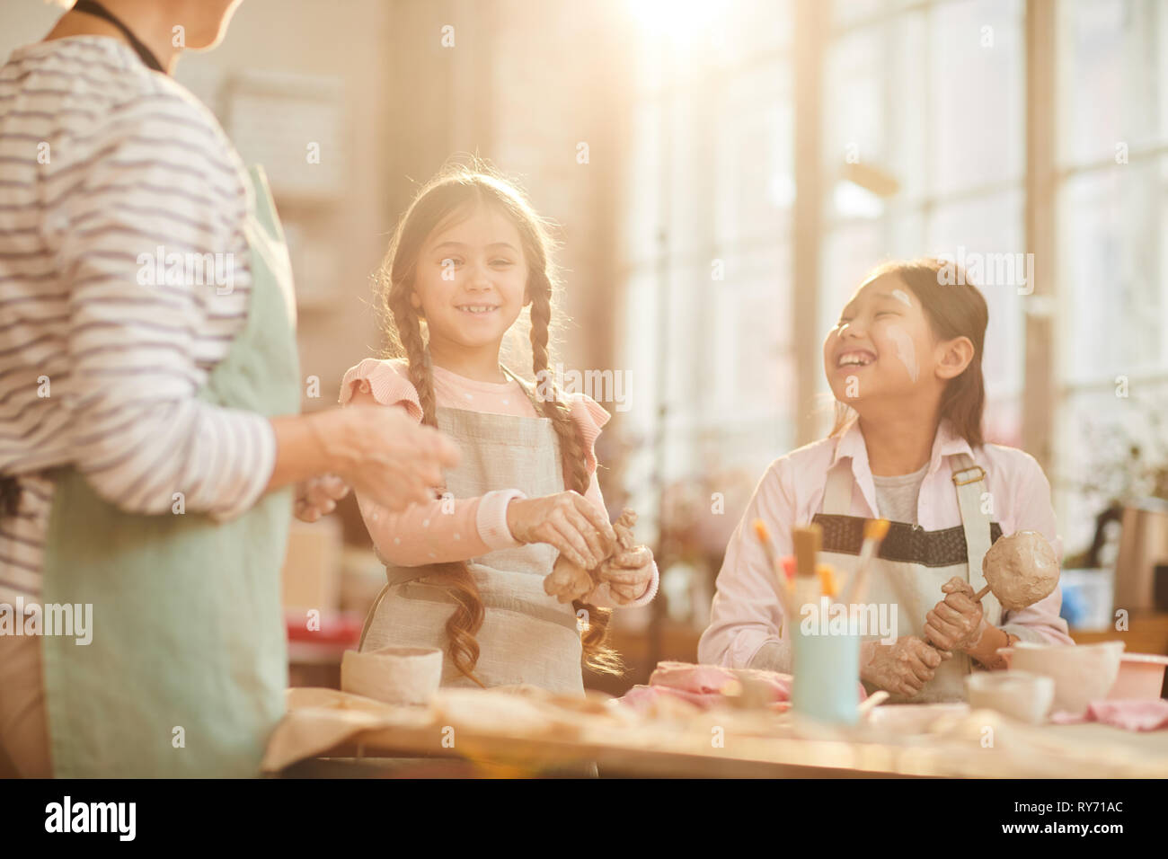 Little Girls in Pottery Workshop Stock Photo - Alamy