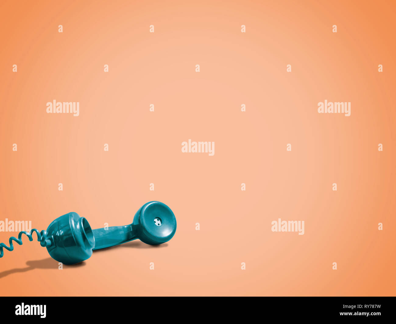 Vintage telephone on orange background Stock Photo - Alamy