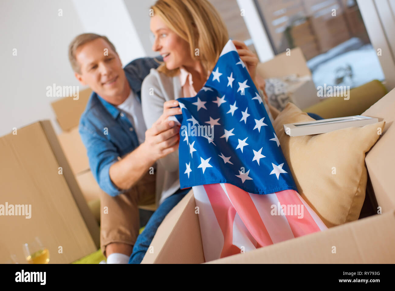 selective focus of woman getting usa flag out of cardboard box Stock ...