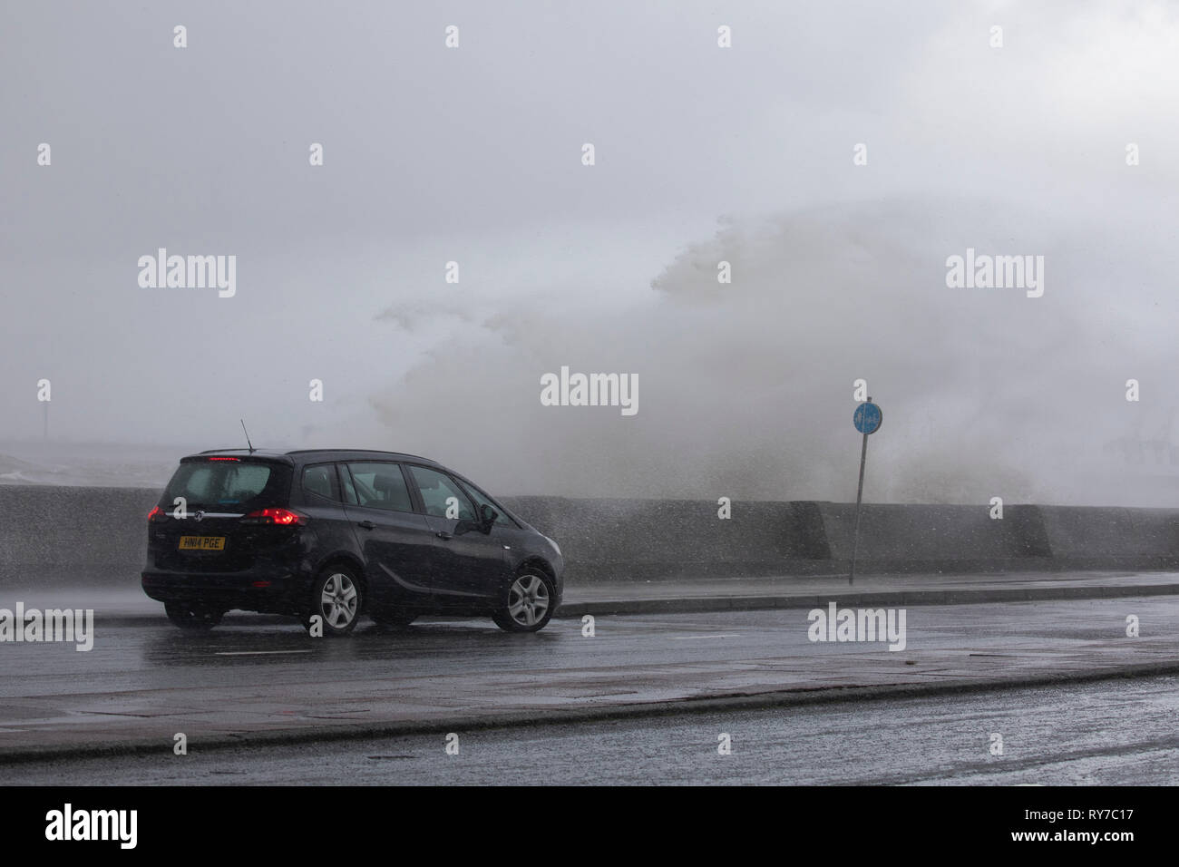 Wirral, New Brighton and Perch Rock lashed by wind and waves Stock ...