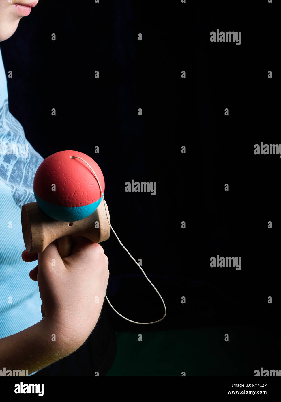 boy playing wooden kendama, classic japanese game Stock Photo - Alamy