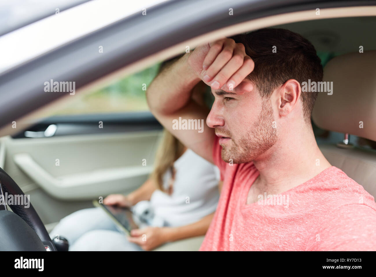 Young man in the car as a stressed and exhausted car driver Stock Photo ...