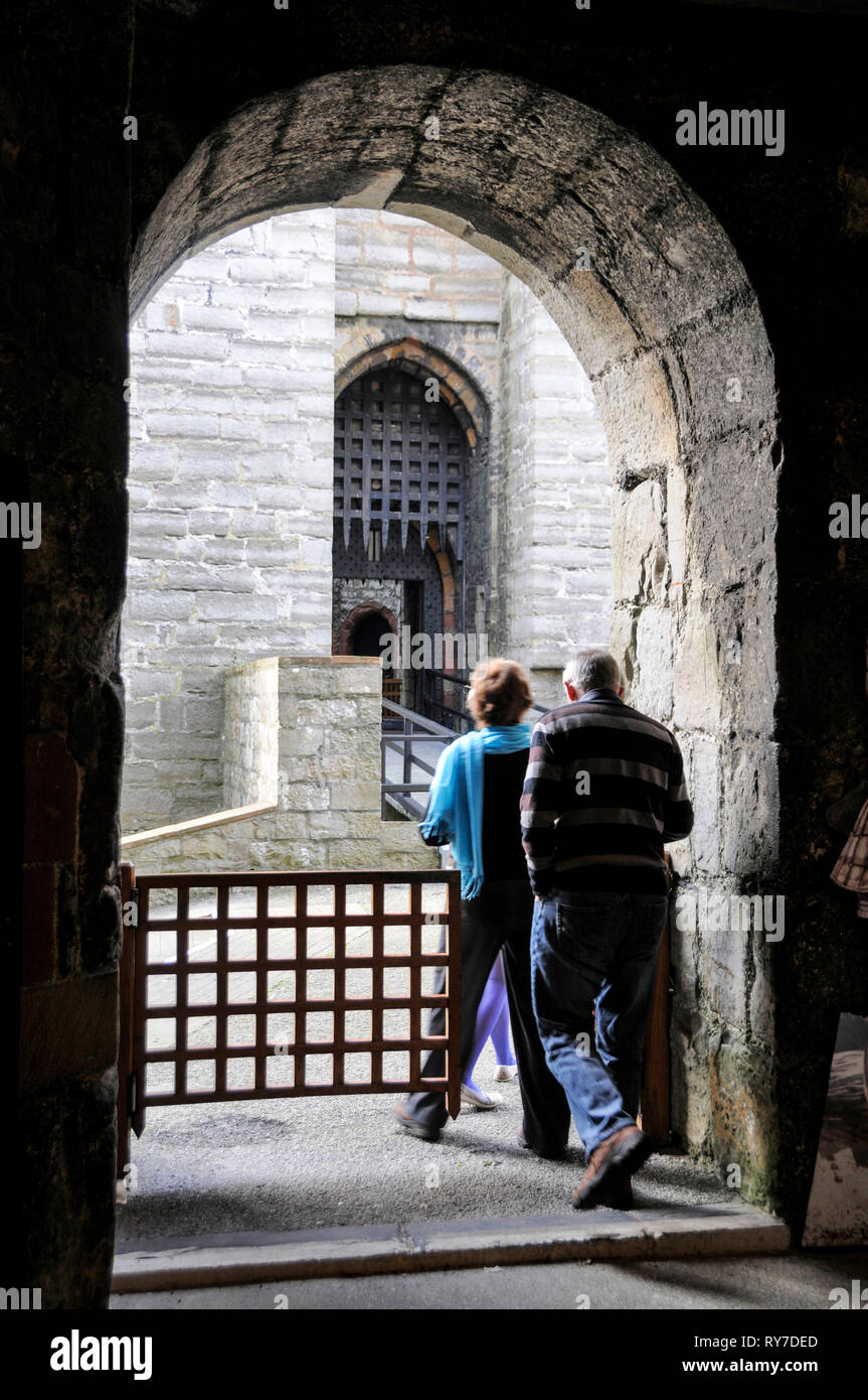 Visitors arriving at the main gated entrance to the 12th/13th century ...