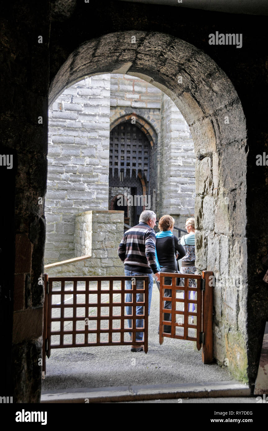 Visitors arriving at the main gated entrance to the 12th/13th century ...