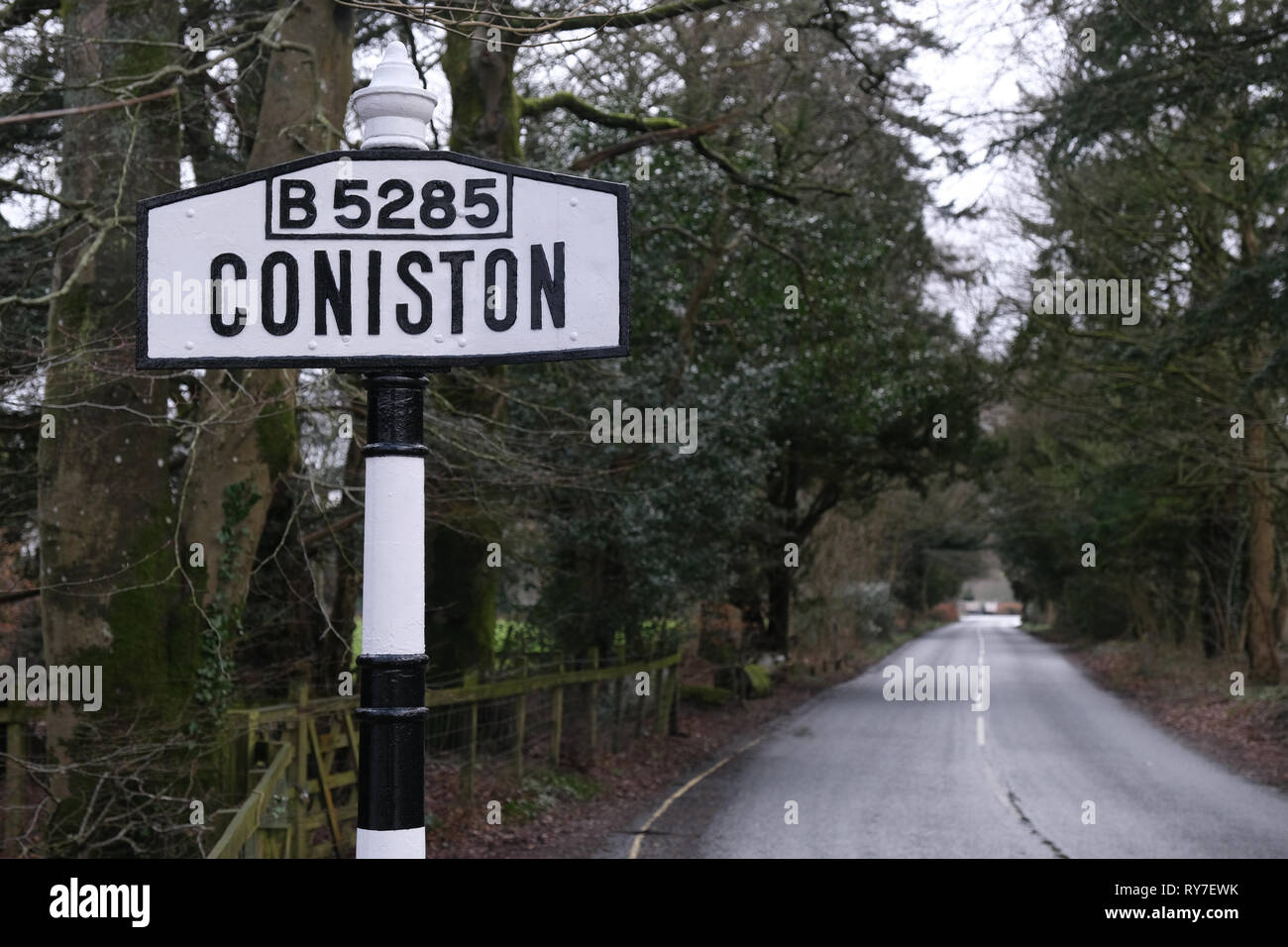 Black and White stripped roadsign at Coniston Village in the Lake ...