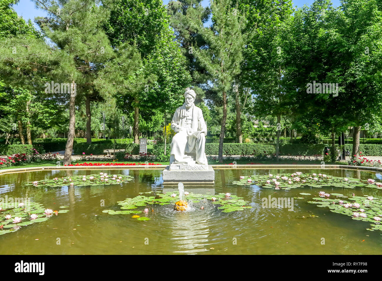Tus Tomb of Ferdowsi Statue on Fountain Pool with Water Lily Stock ...