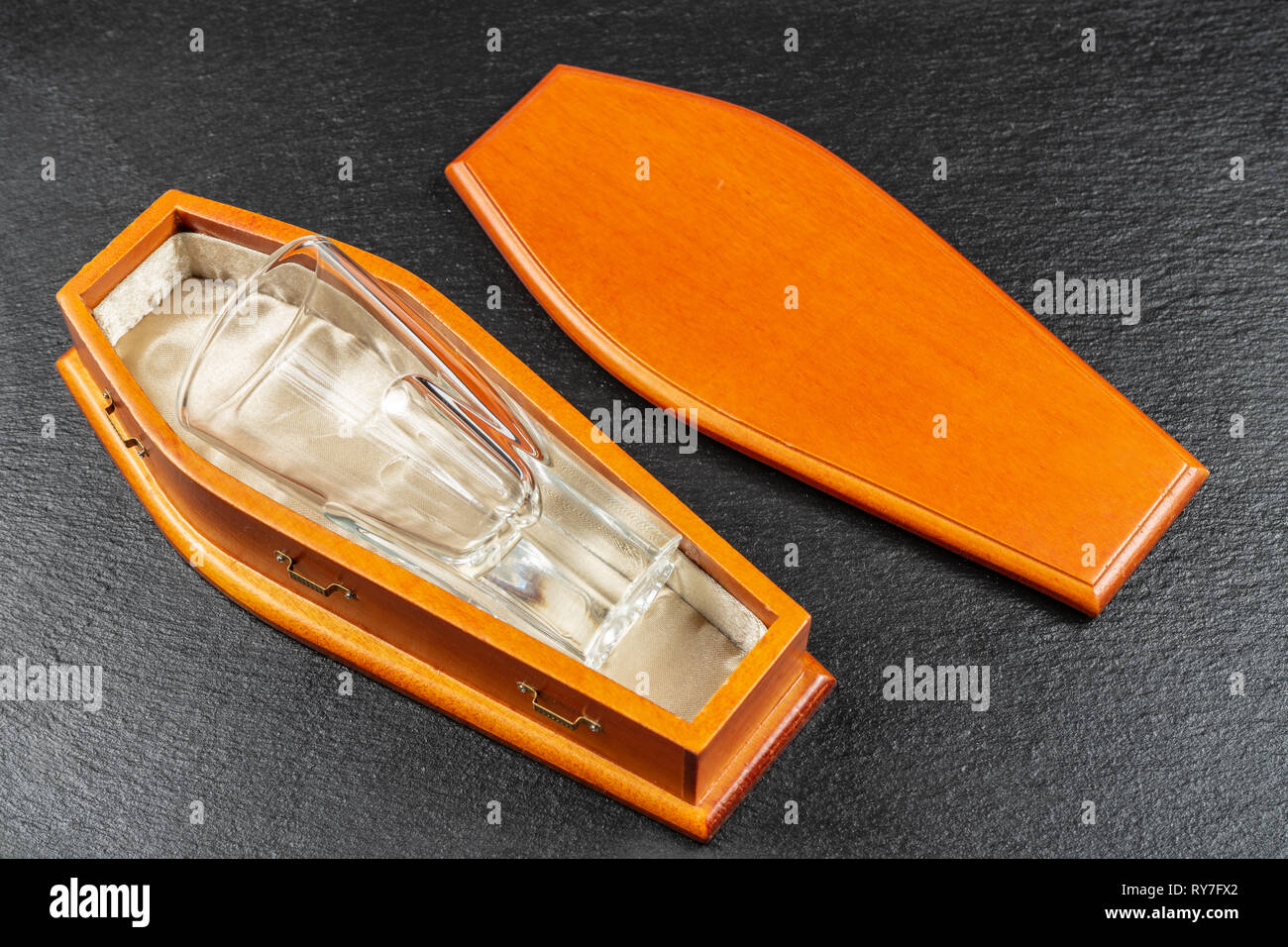 Alcohol is killing.Drinking is killing consept.Shot glass in coffin ...