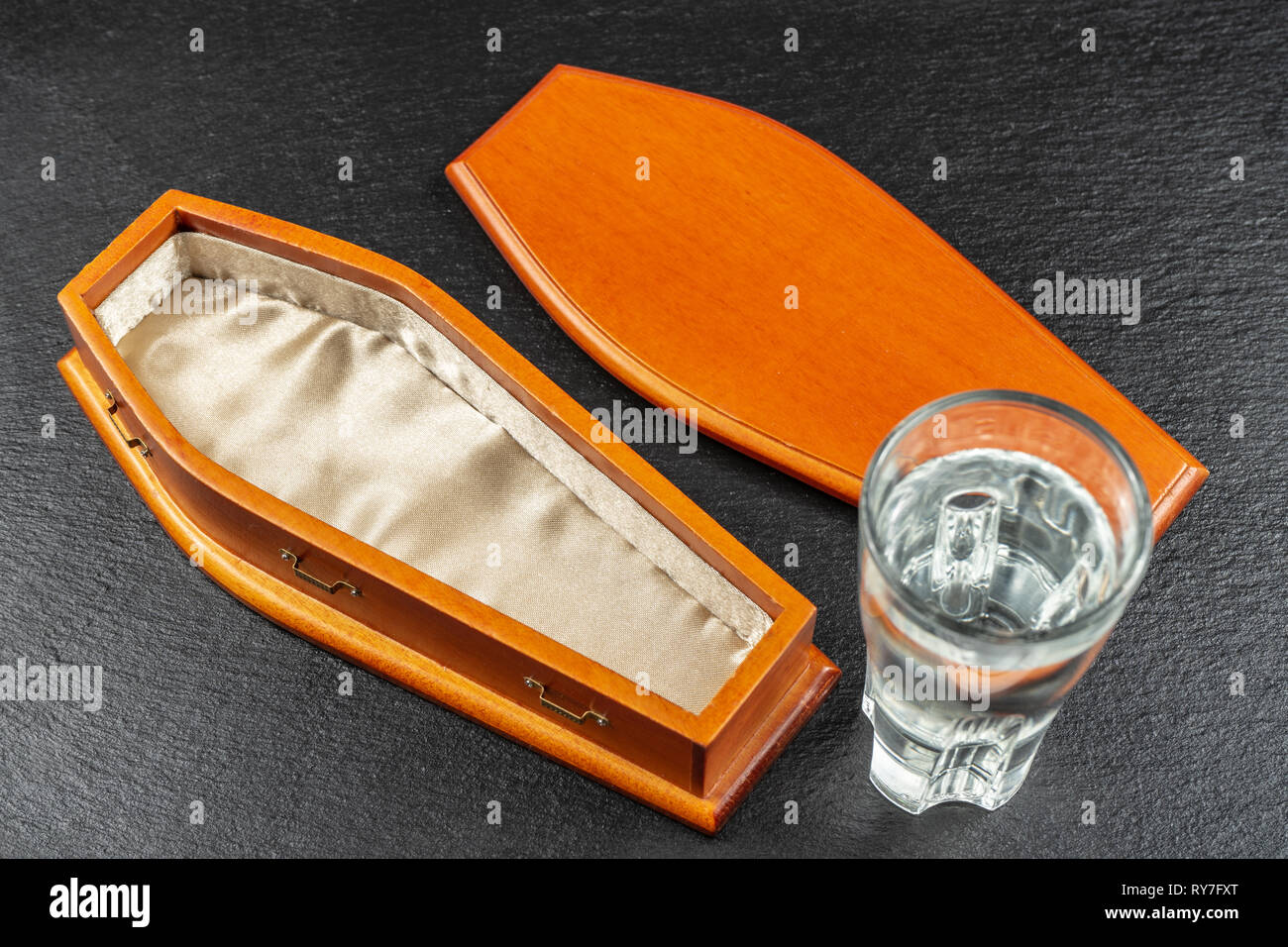 Alcohol is killing.Drinking is killing consept.Shot glass in coffin ...