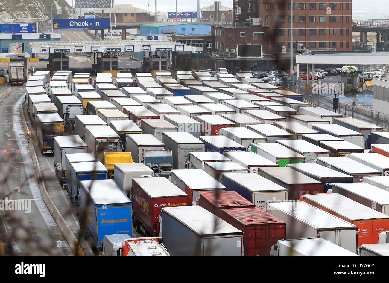 Lorries queue at the entrance to the Port of Dover in Kent as bad ...