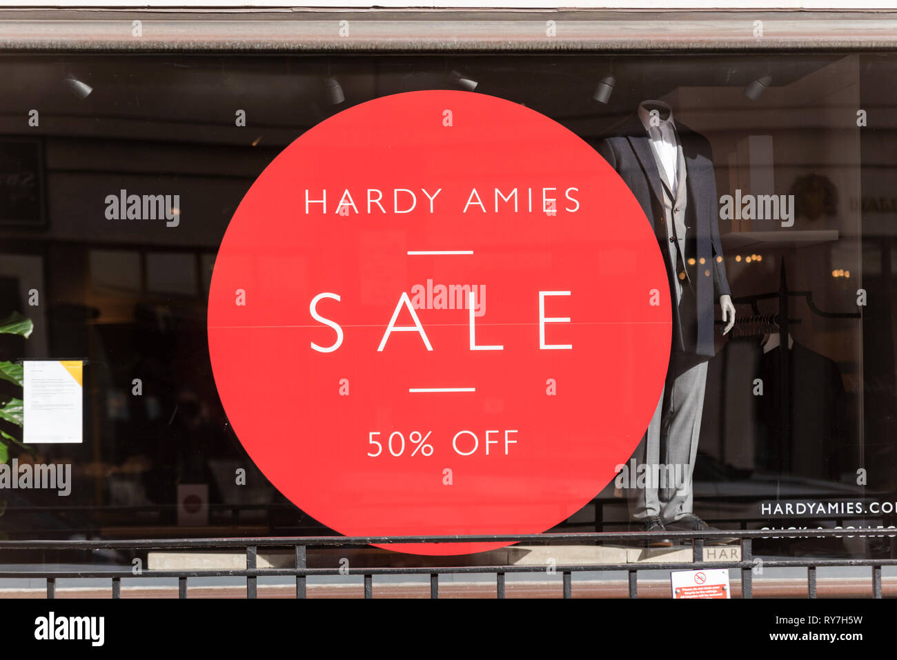 Hardy Amies shop front window display with 50% sale sign notice. Store ...