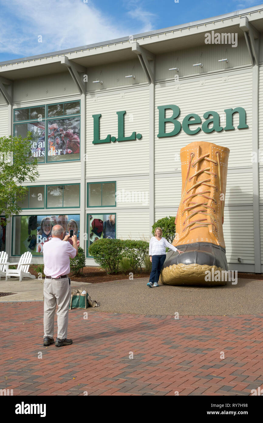 Visitors taking a souvenir picture with the 90th anniversary bean boot ...