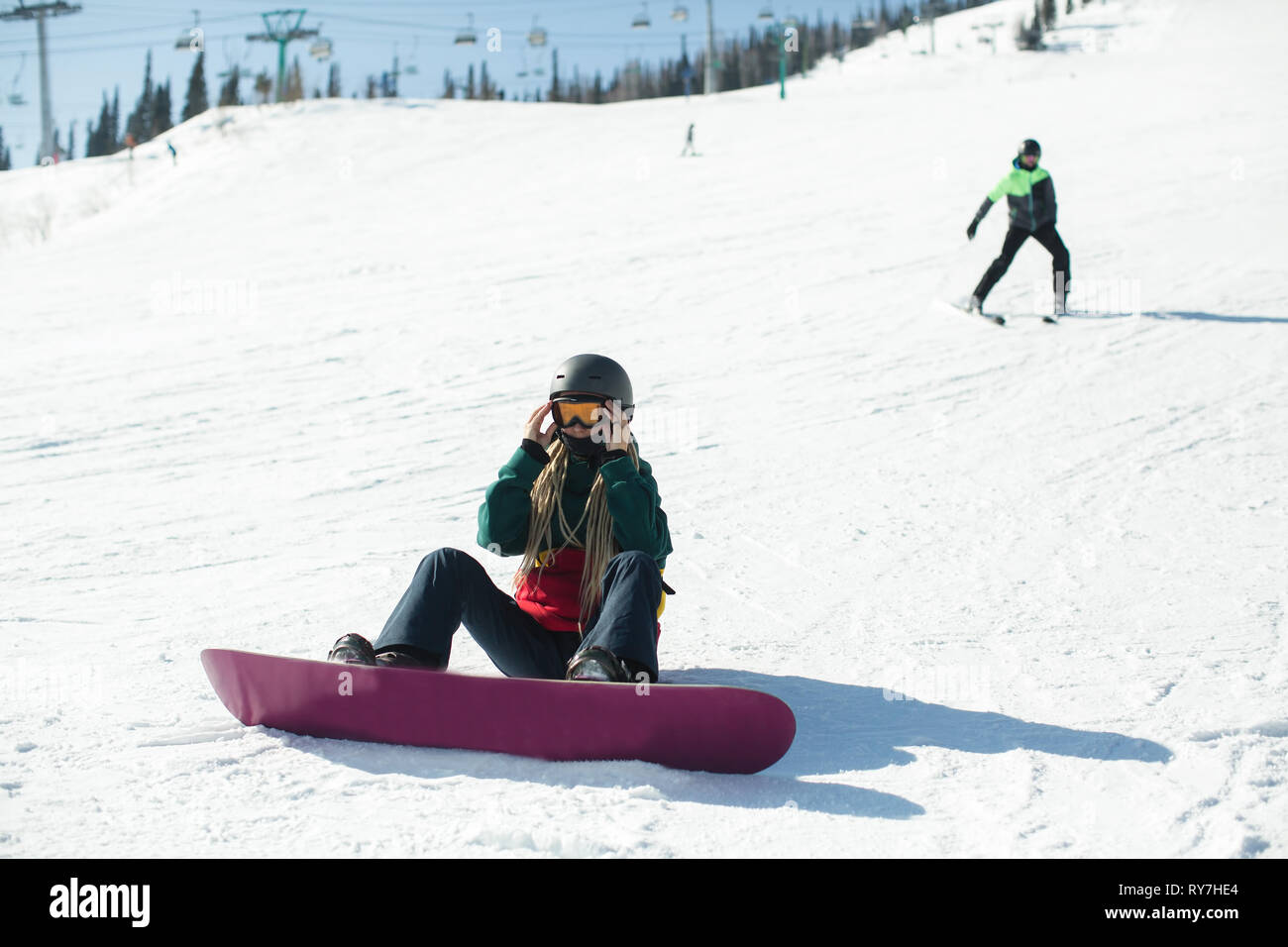 Girl sitting ski board hi-res stock photography and images - Alamy