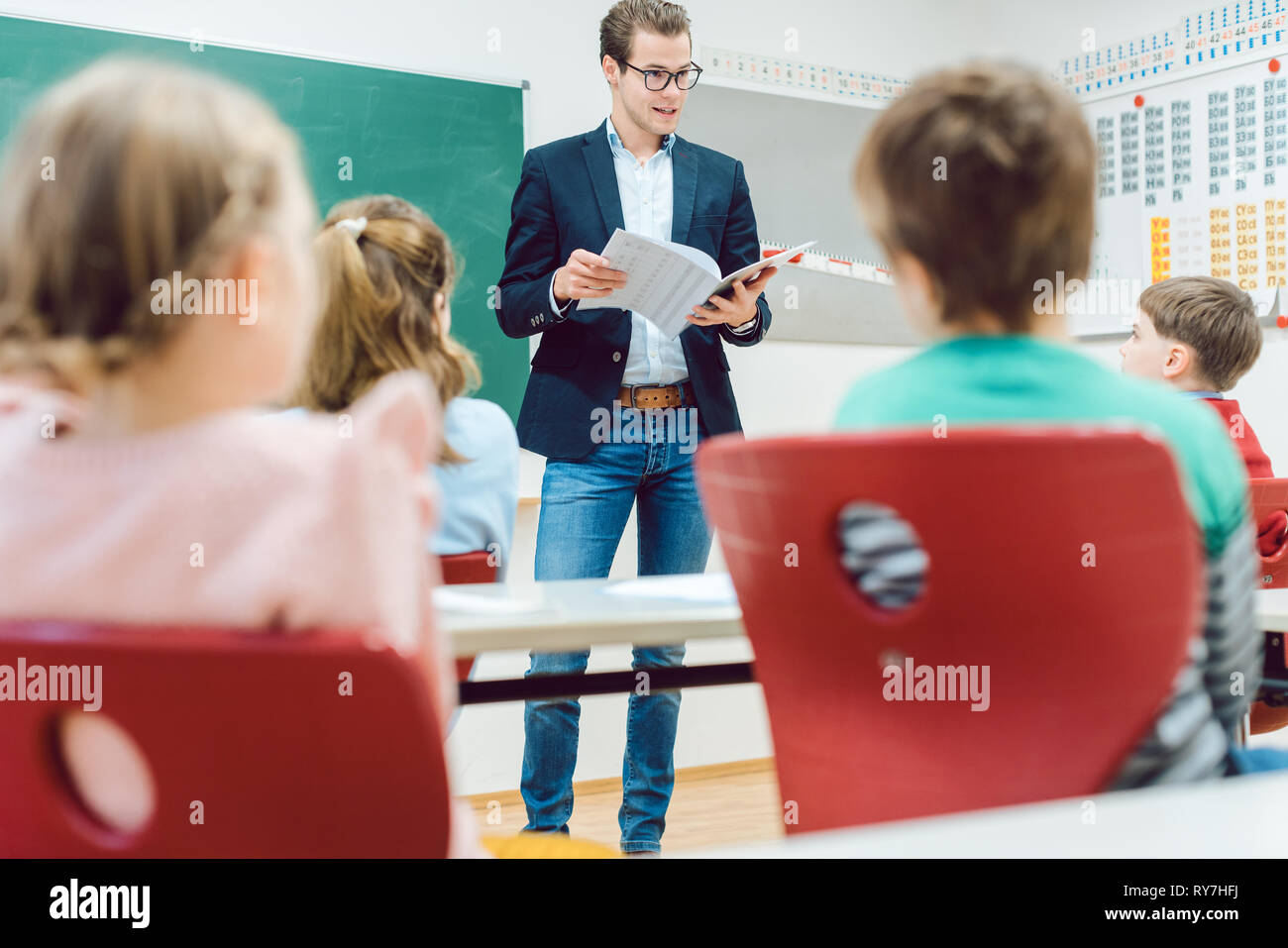 Teacher and student and giving paper hi-res stock photography and ...