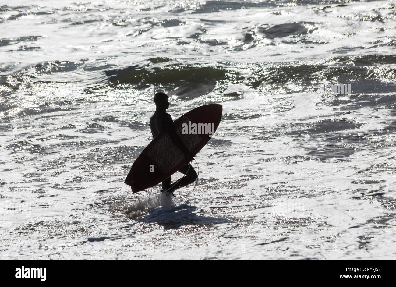 Surfer holding surf board hi-res stock photography and images - Alamy