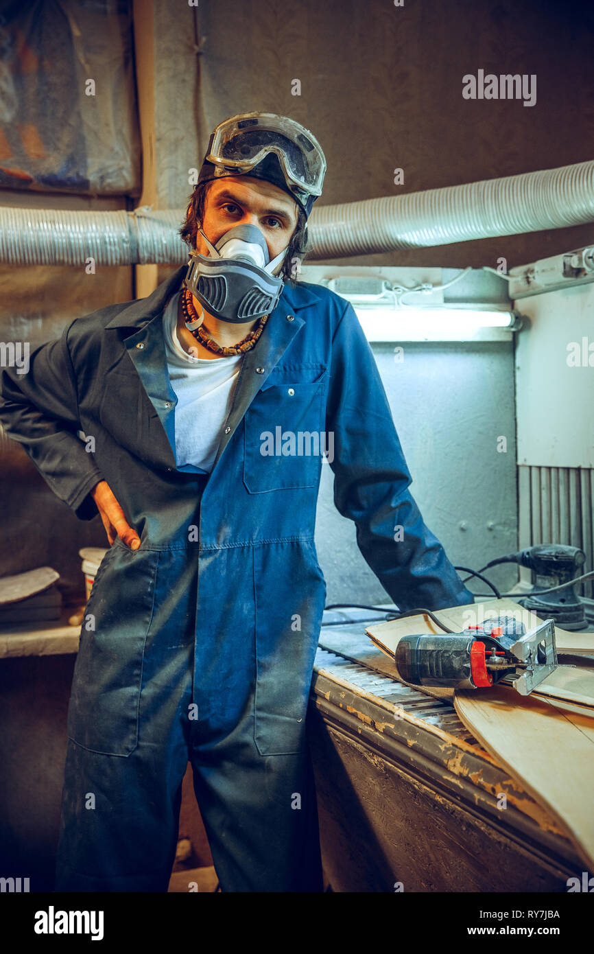 Portrait of serious carpenter at his work place Stock Photo - Alamy