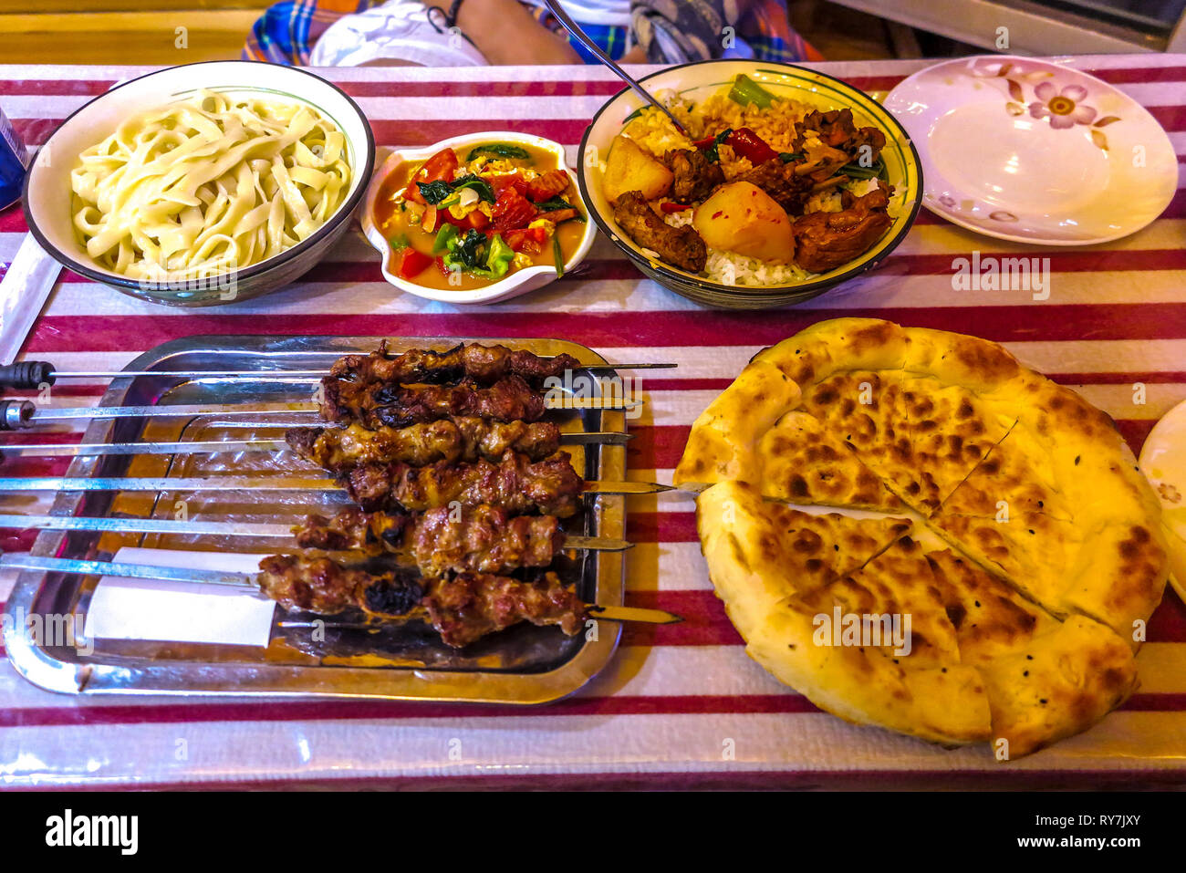 Uyghur Traditional Hot Spicy Lamb Skewers with Cumin and Naan Bread ...