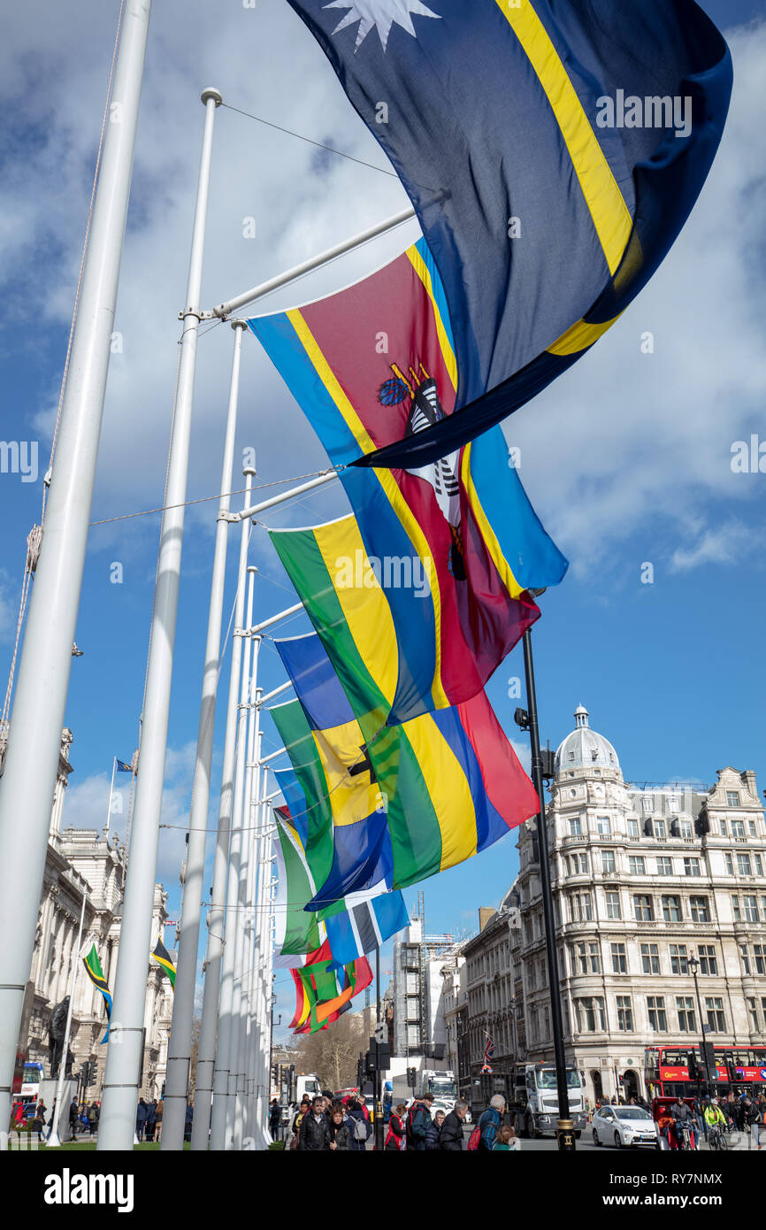 Flags of the Commonwealth countries are flying around Parliament Square ...