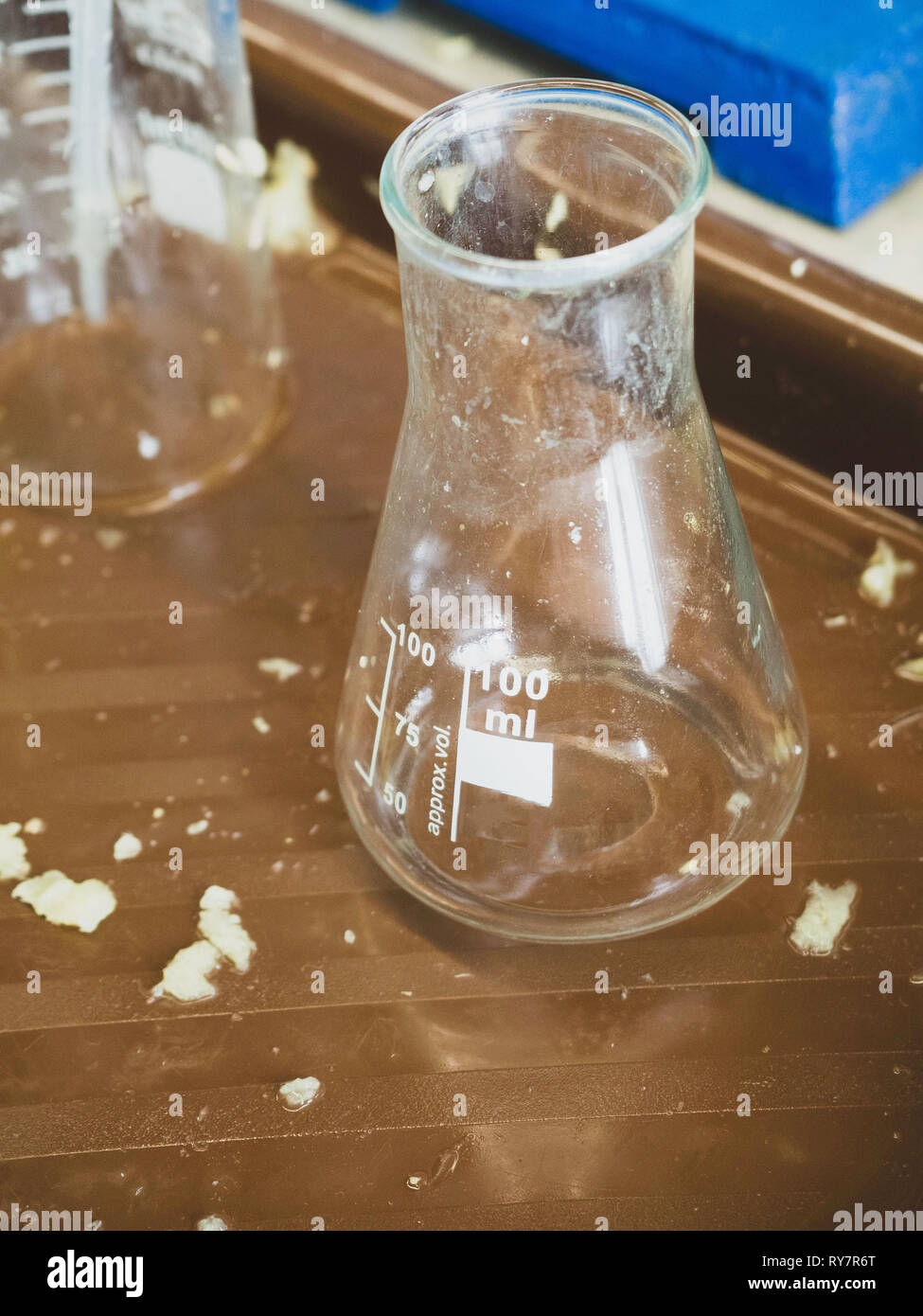 Cosmetic chemicals ingredient on laboratory table in transparent bulb ...