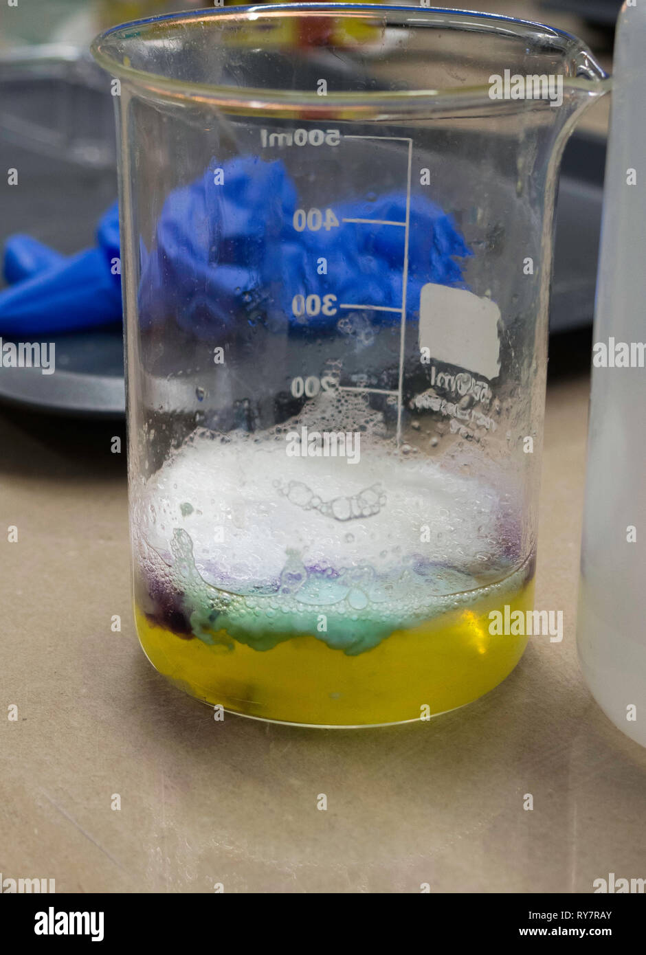 Cosmetic chemicals yellow ingredient in bulb on laboratory table Stock ...