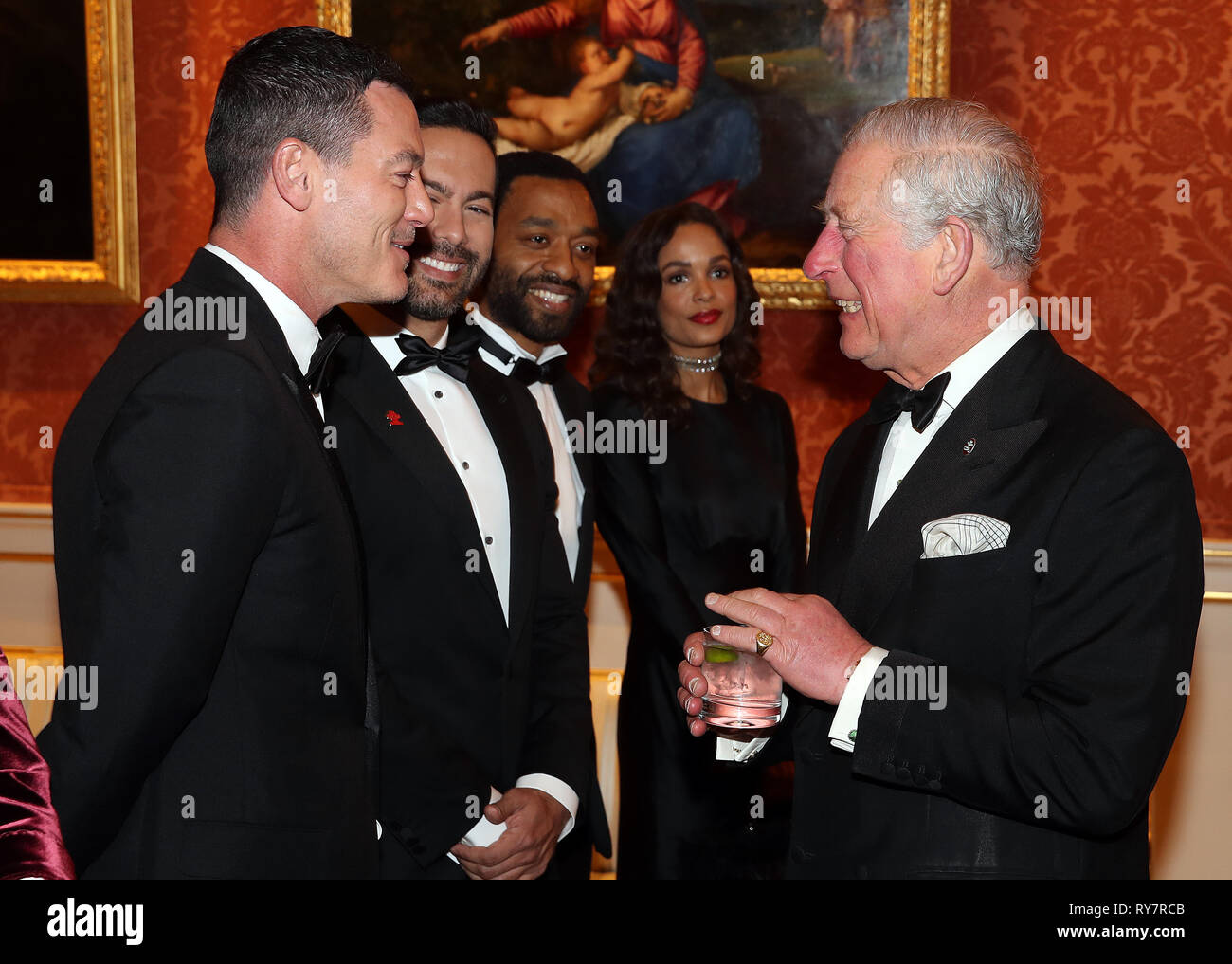 The Prince of Wales speaks to Luke Evans (left) at a dinner for donors ...
