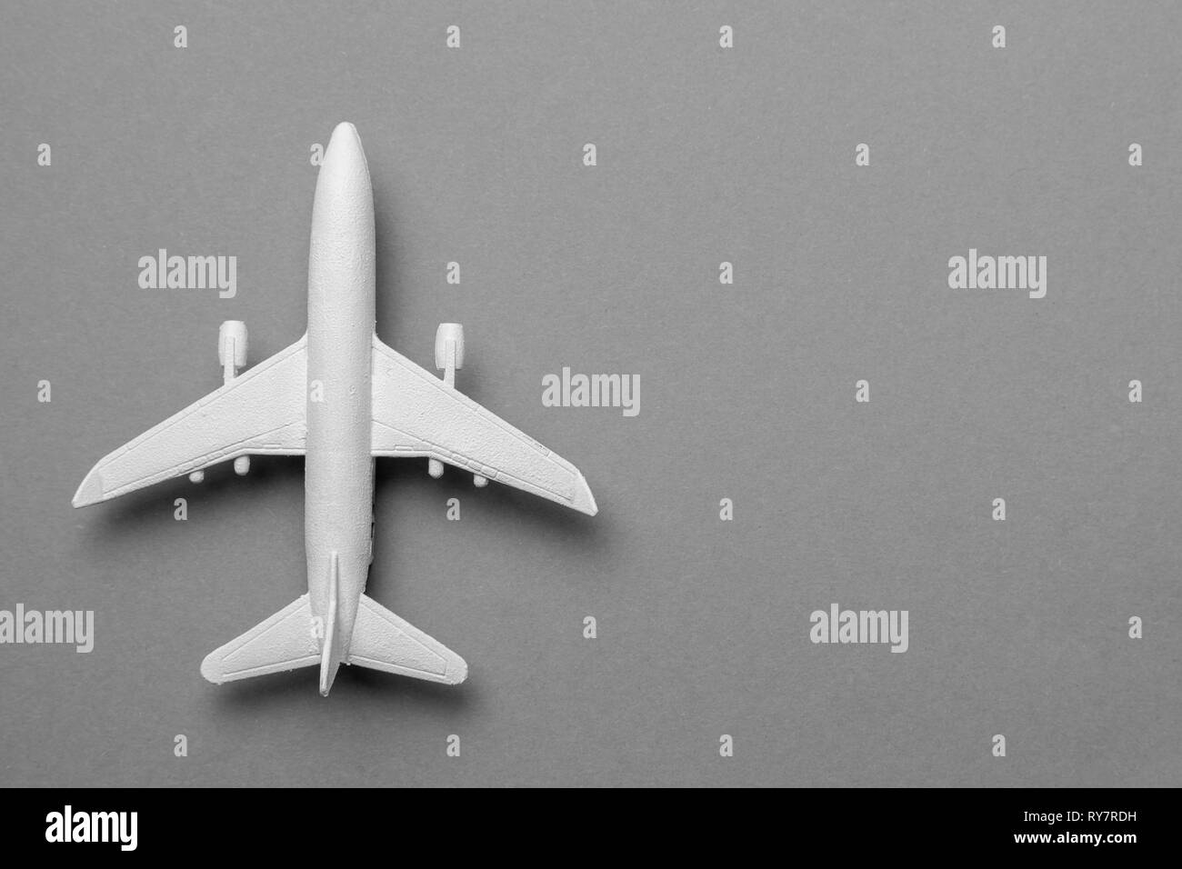 White passenger plane on gray background. Copy space for text Stock ...