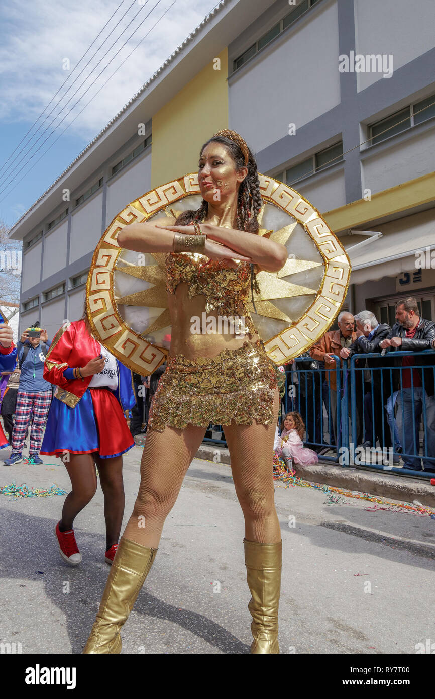 Xanthi, Greece Woman leading carnival parade with golden painted body ...
