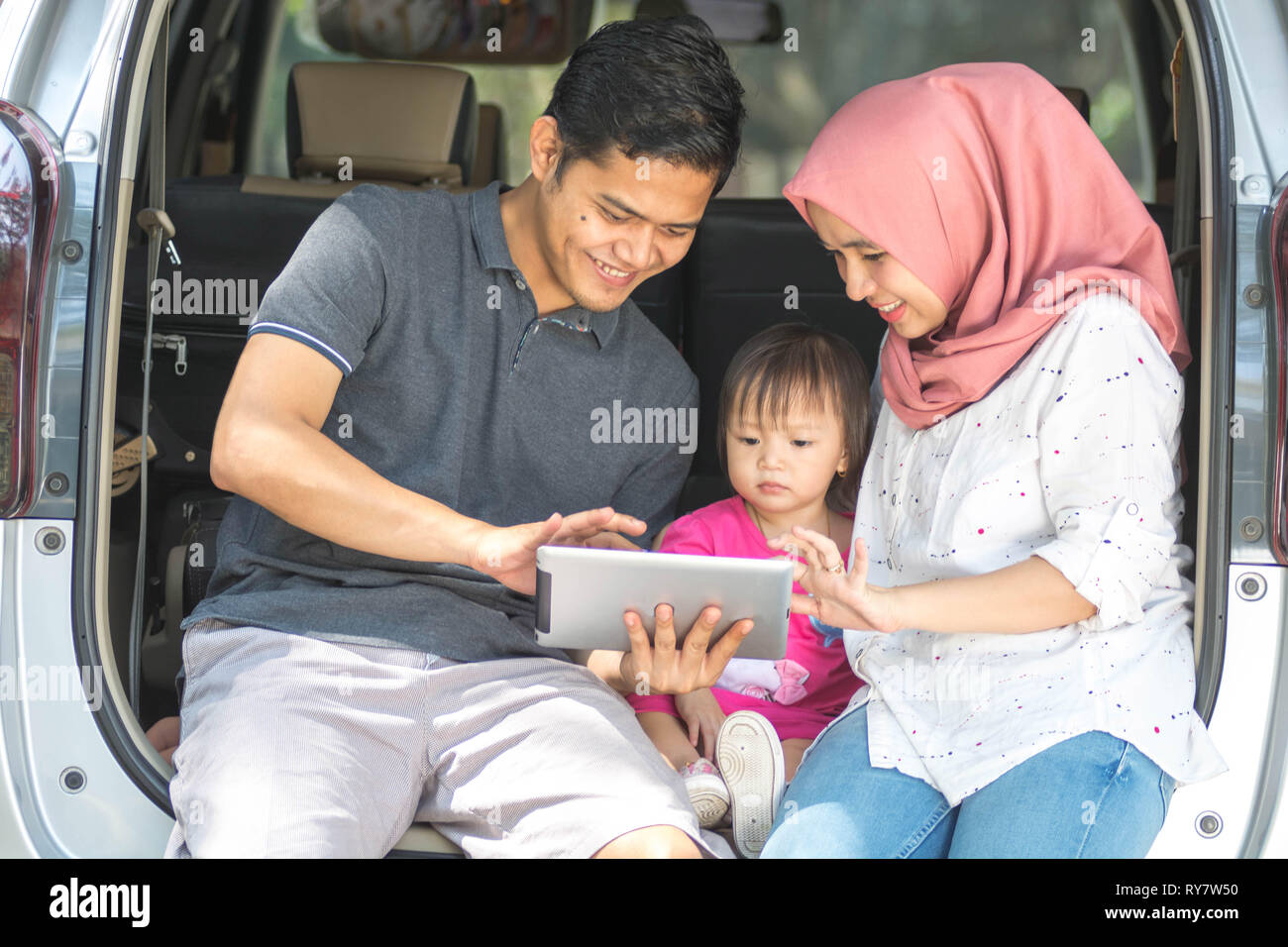 young muslim family , transport, leisure, road trip and people concept ...