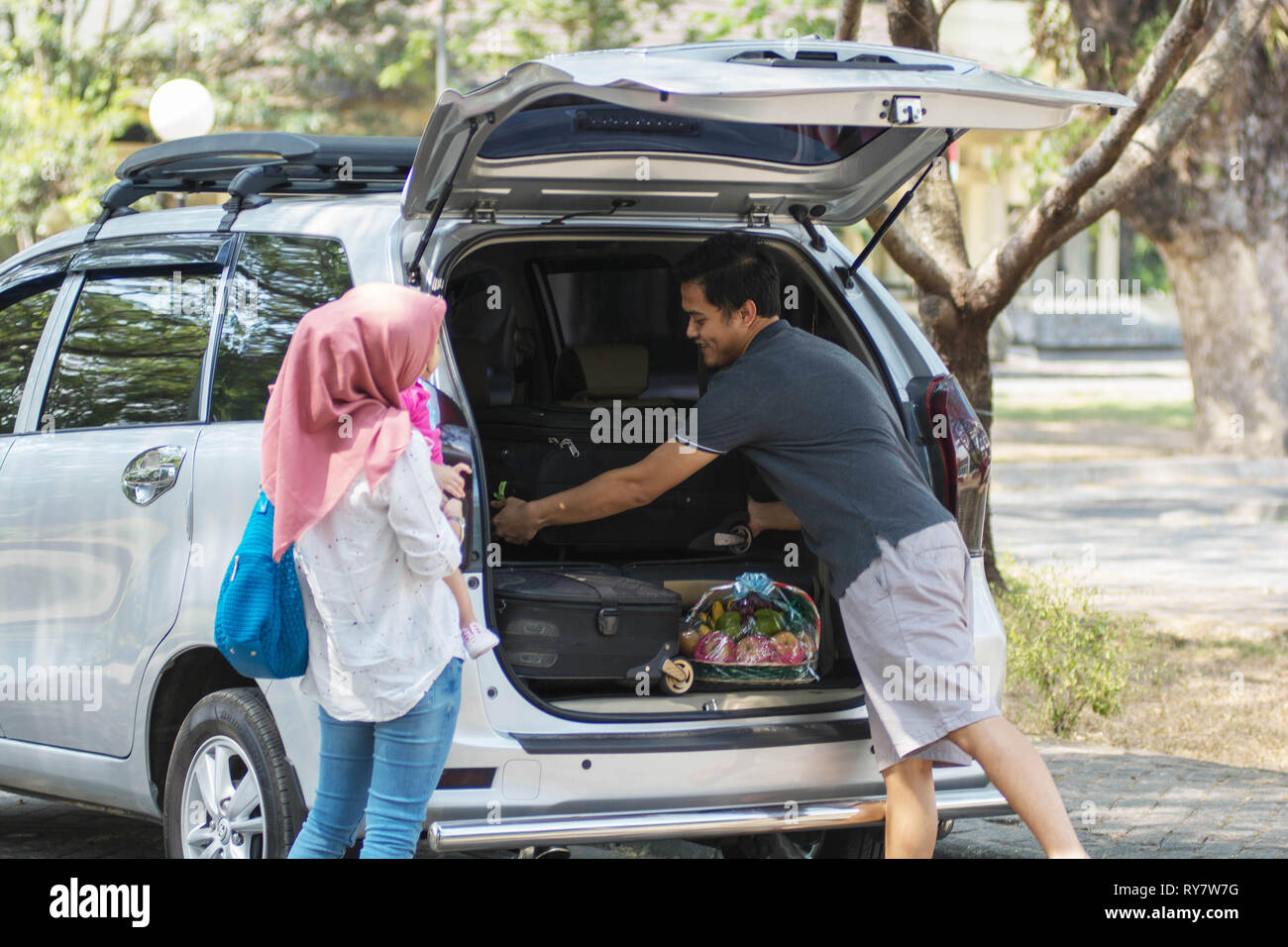 young muslim family , transport, leisure, road trip and people concept ...