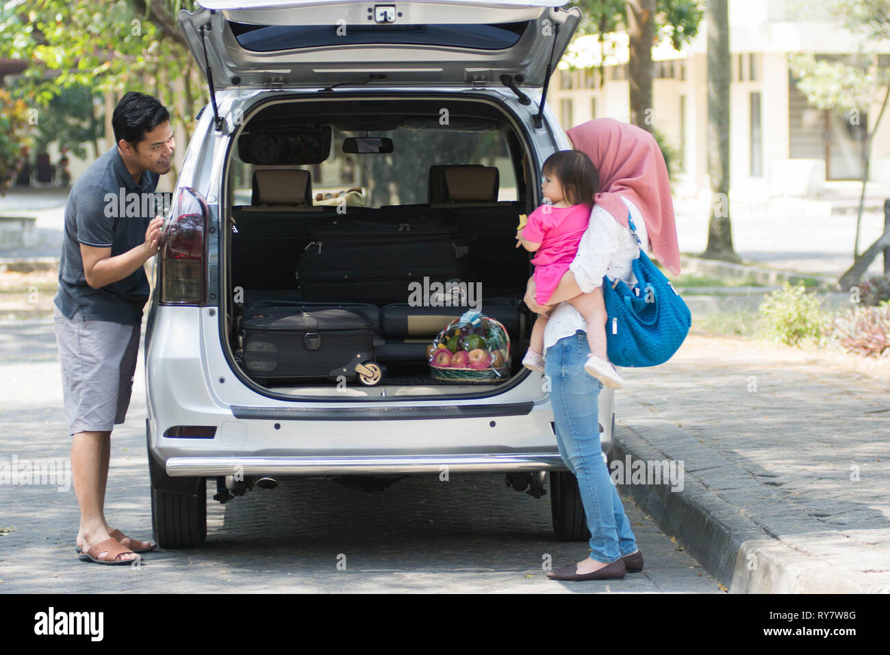 young muslim family , transport, leisure, road trip and people concept ...