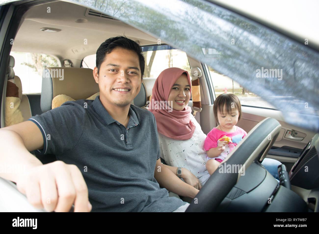 young muslim family , transport, leisure, road trip and people concept ...