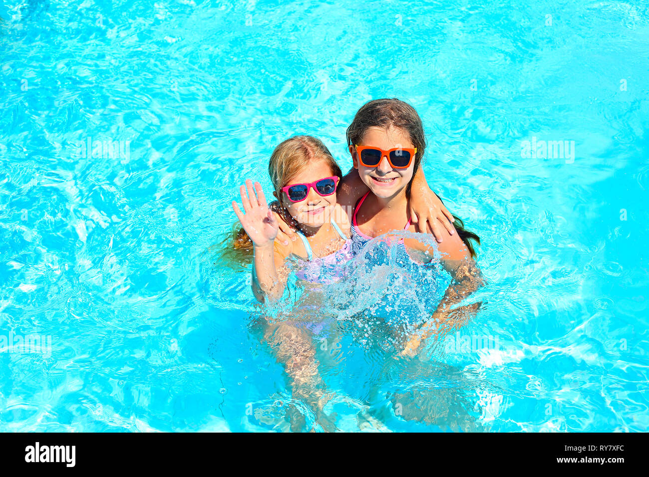 Portrait two friends in pool hi-res stock photography and images - Alamy